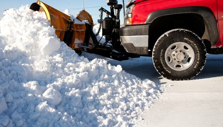 Pickup with snowplow backs into van during snow removal from streets in ...