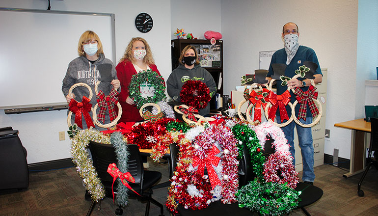 NCMC Upward Bound students bring holiday cheer to Sunnyview
